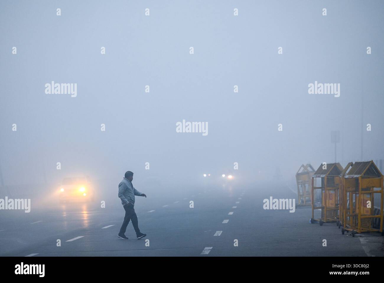 NEW DELHI, INDIA - DECEMBER 20: People seen out on a cold and Foggy ...