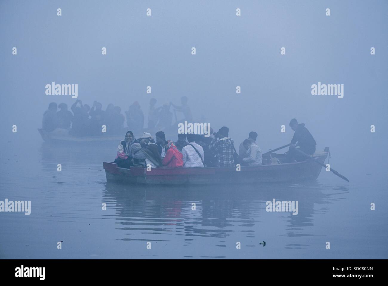 NEW DELHI, INDIA - DECEMBER 20: People seen out on a cold and Foggy ...