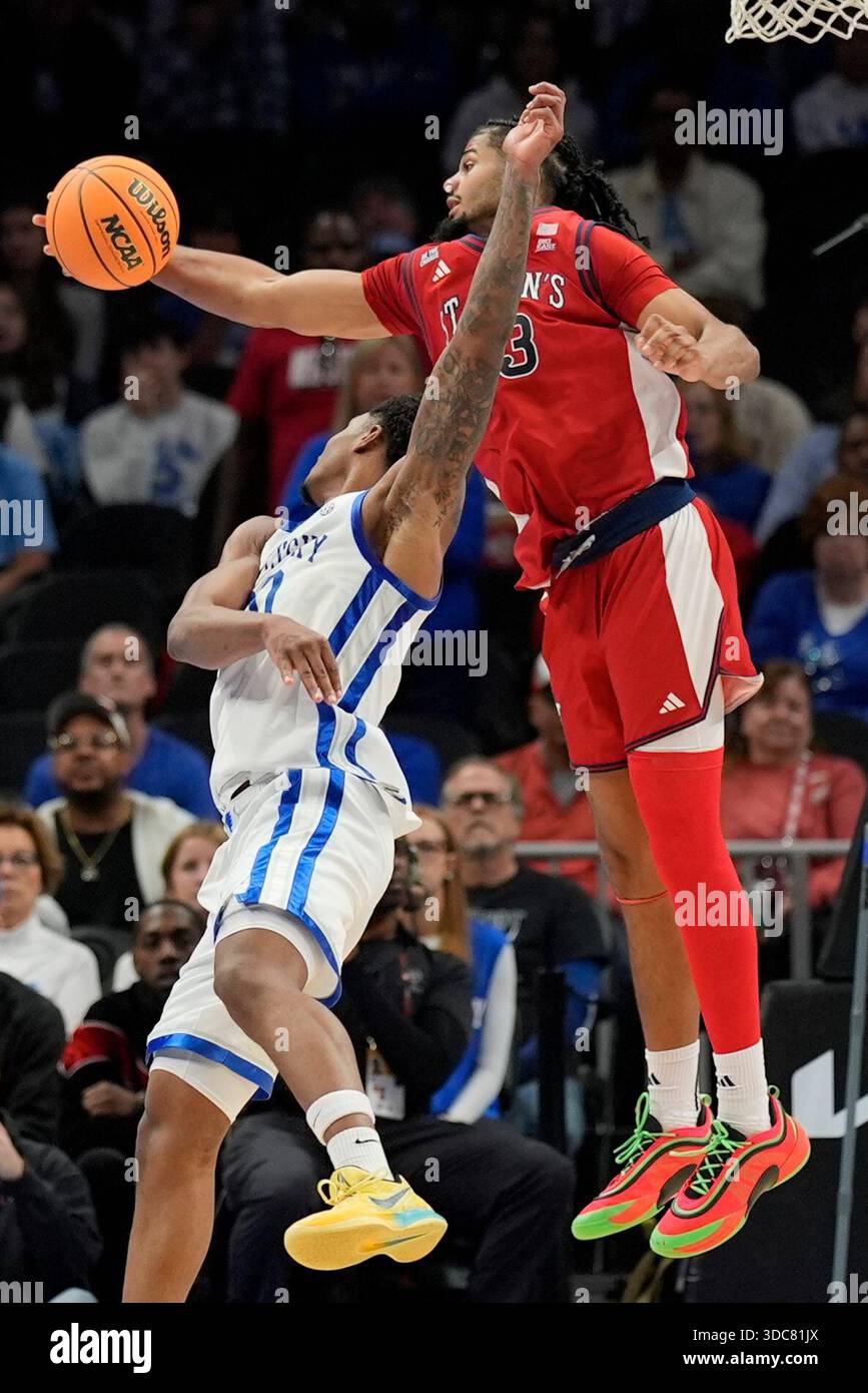 St. John's forward Bryce Hopkins (23) shoots over Kentucky guard Otega ...