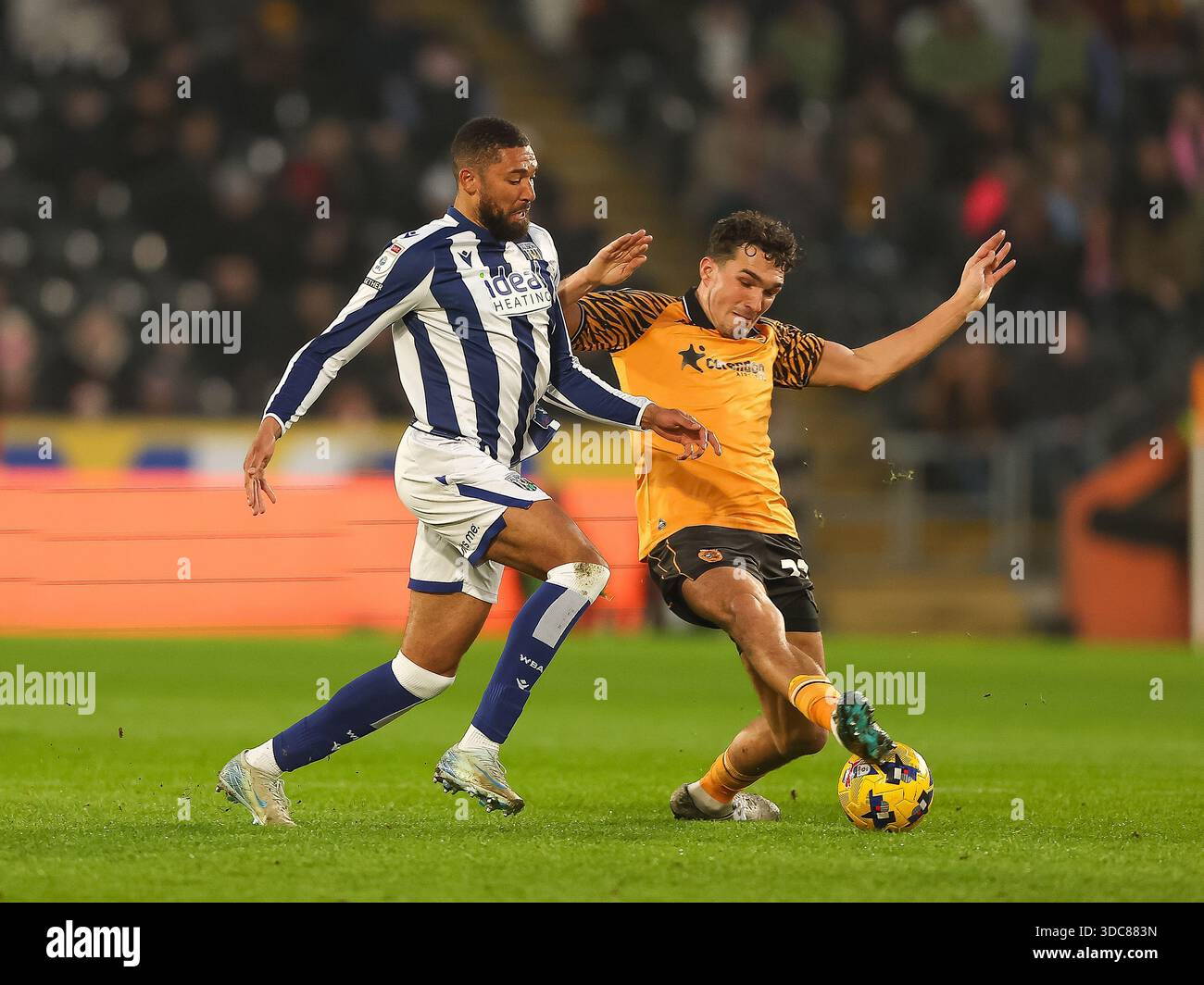 HULL, ENGLAND - DECEMBER 20: Kyle Joseph of Hull City tackles George ...