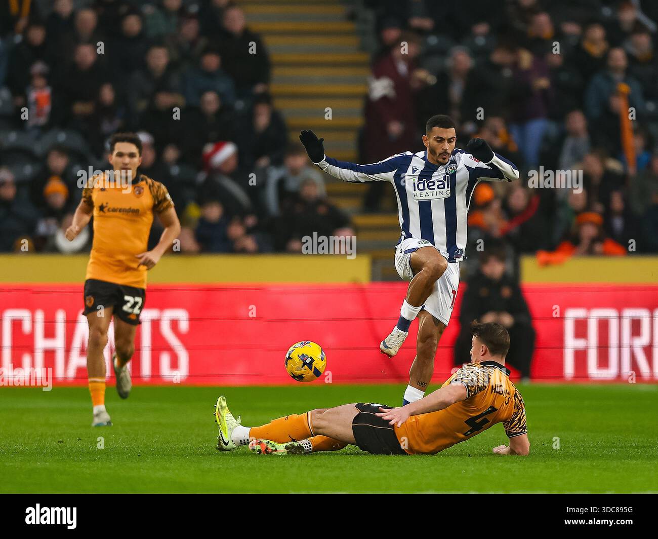 HULL, ENGLAND - DECEMBER 20: Charlie Hughes of Hull City tackles Karlan ...