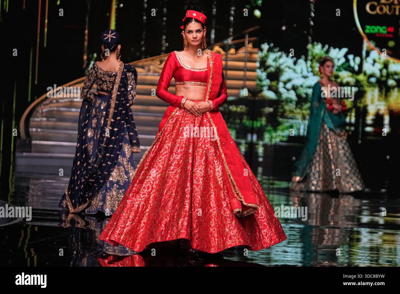 Models present creations of designer Raja Salahuddin during the "Bridal ...