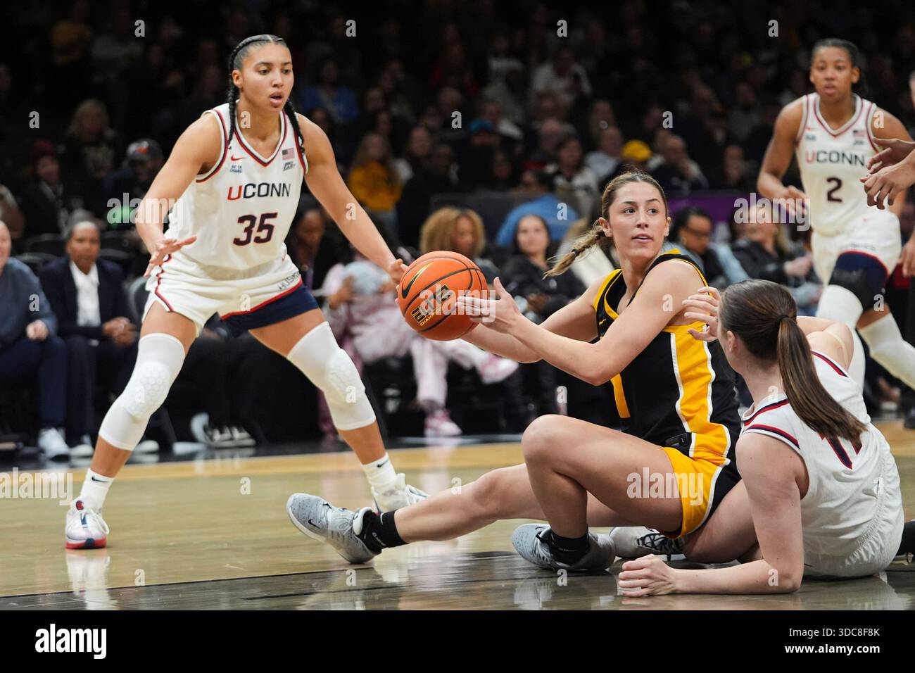 Iowa's Addison Deal (7) passes away from UConn's Allie Ziebell (11) and ...