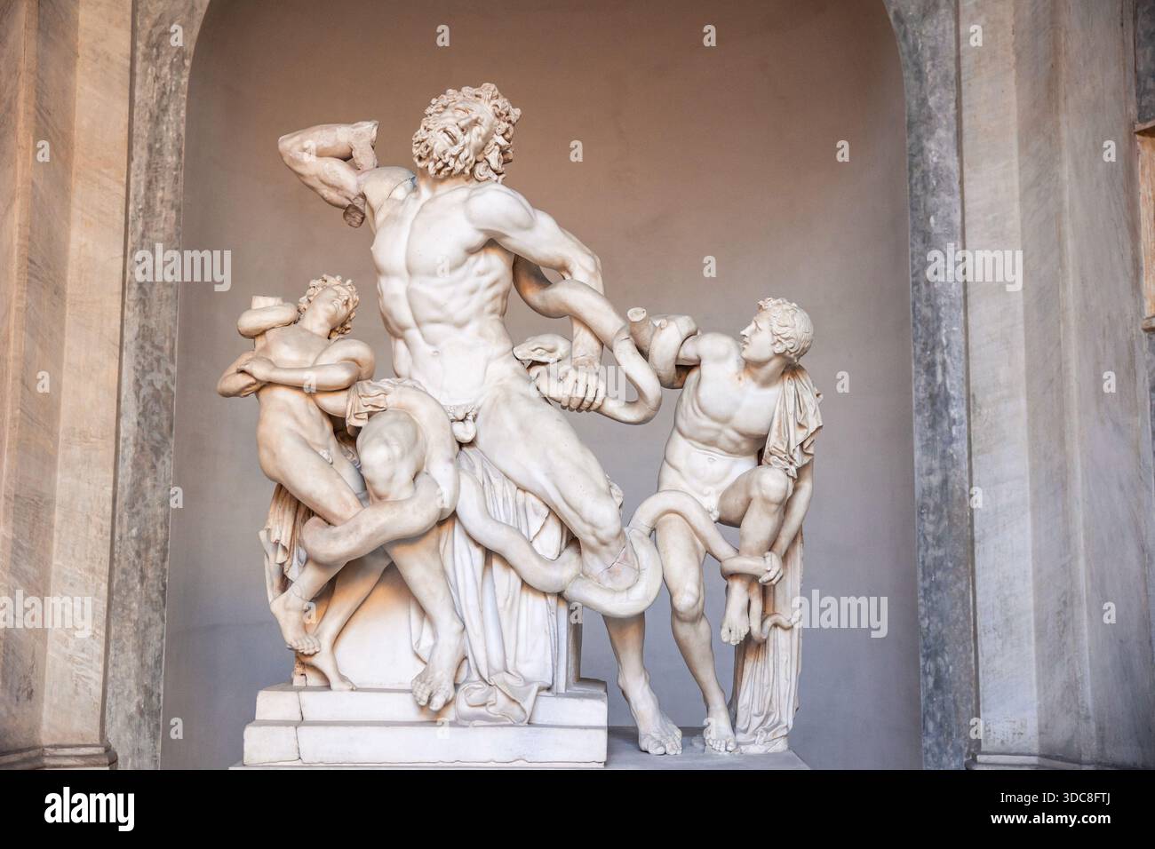 Laocoön and his sons struggle against attacking serpents in the ancient ...