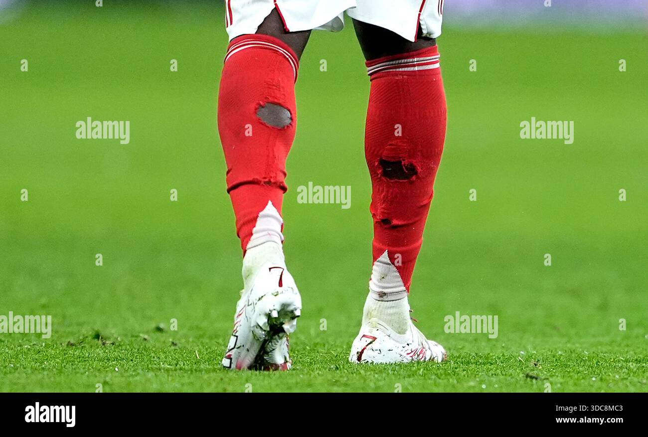 A close up of the socks of Arsenal's Bukayo Saka with holes during the ...