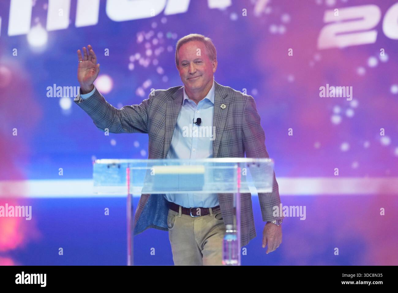 Texas Attorney General Ken Paxton takes the stage during Turning Point ...