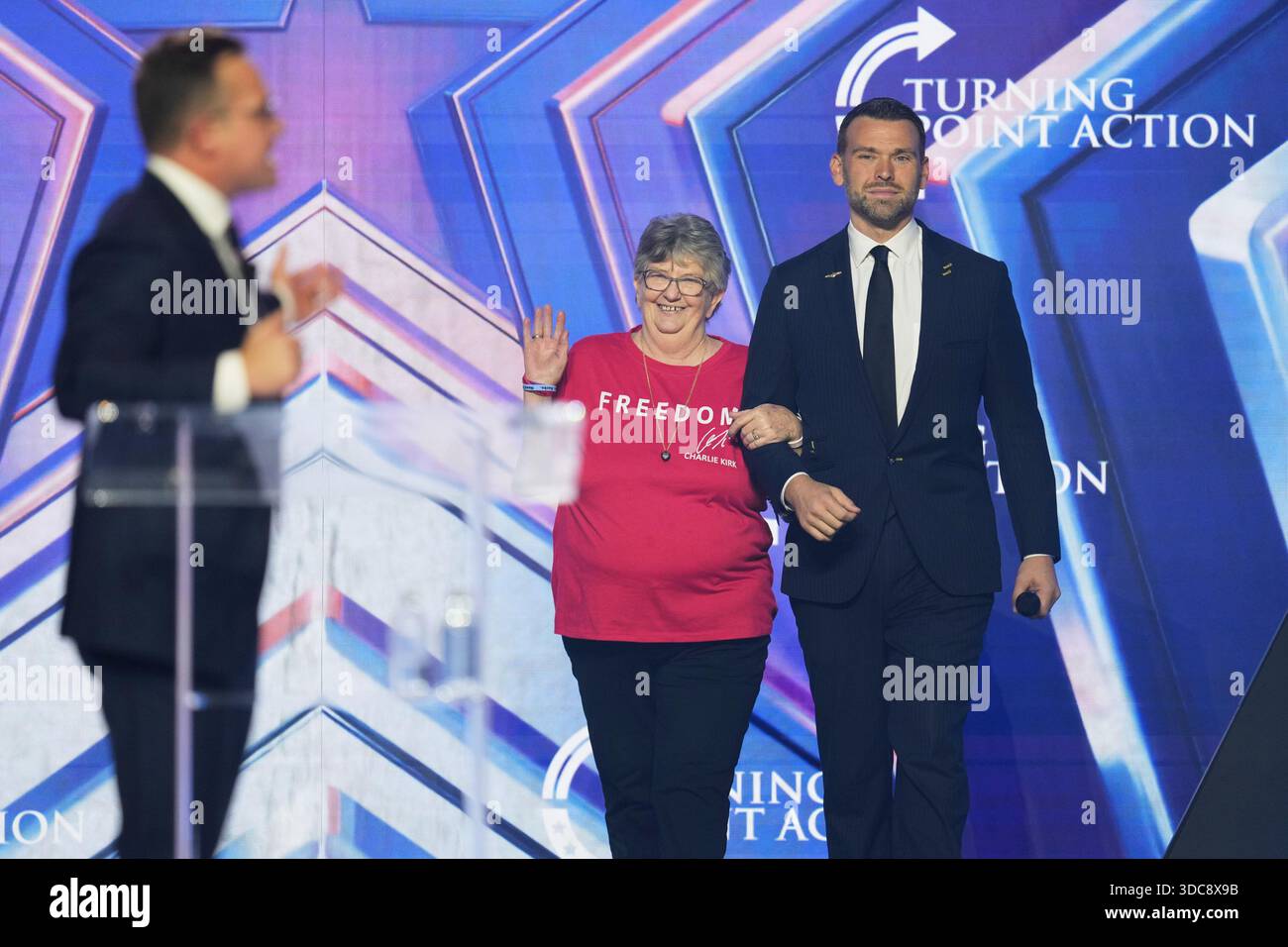 Benny Johnson, left, stands as Jeanie Beeman, center, and Jack Posobiec ...