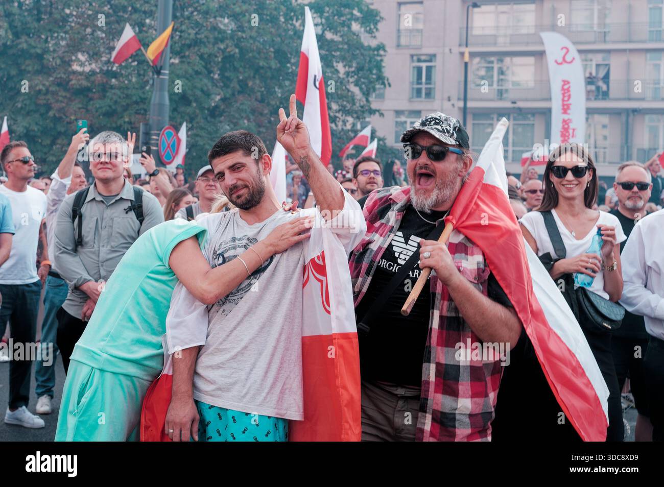 Group of participants pose with Polish flags during Warsaw Uprising ...