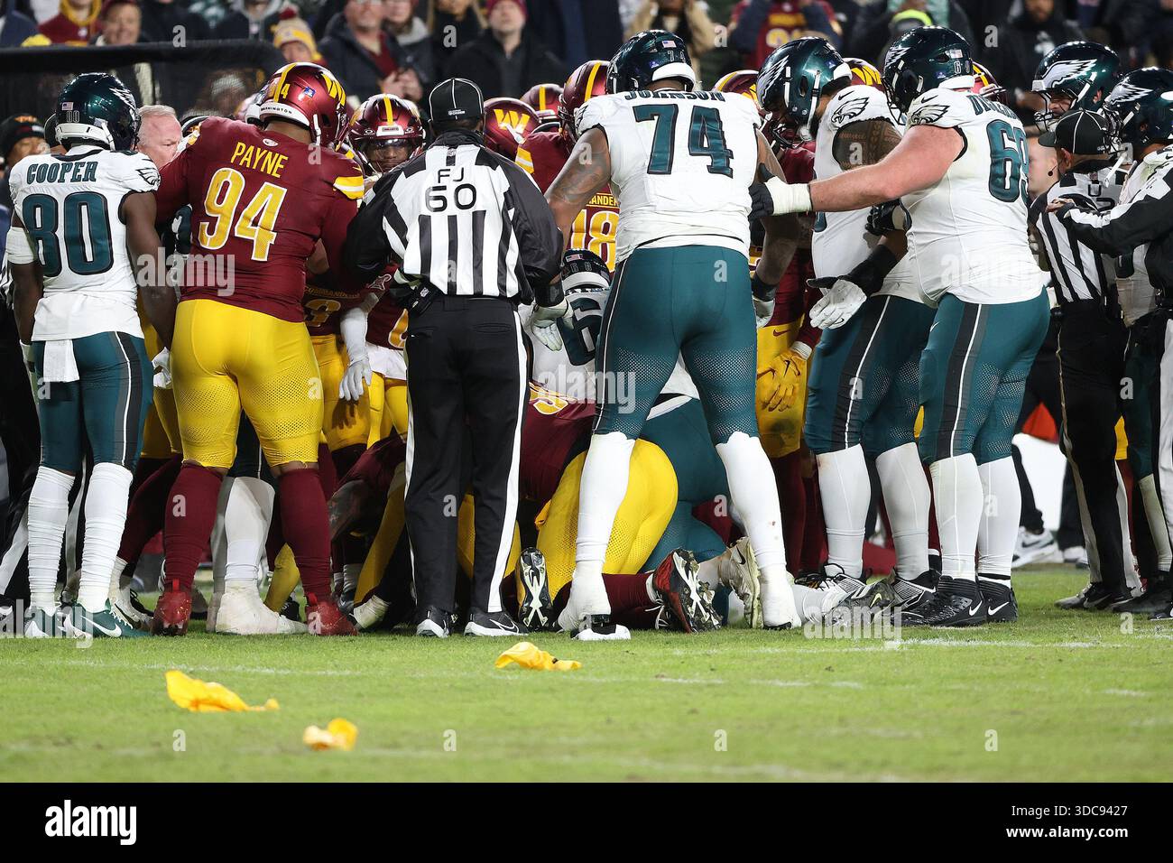 Washington Commanders and Philadelphia Eagles players fight during an ...
