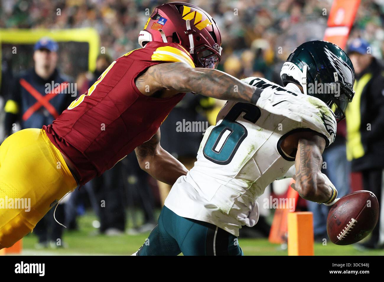 Washington Commanders safety Will Harris (3) knocks the ball away from ...