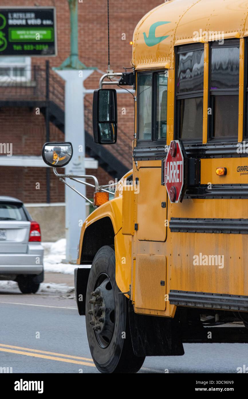 Canada, Quebec, 27 November 2025 : Yellow school bus waits with stop ...