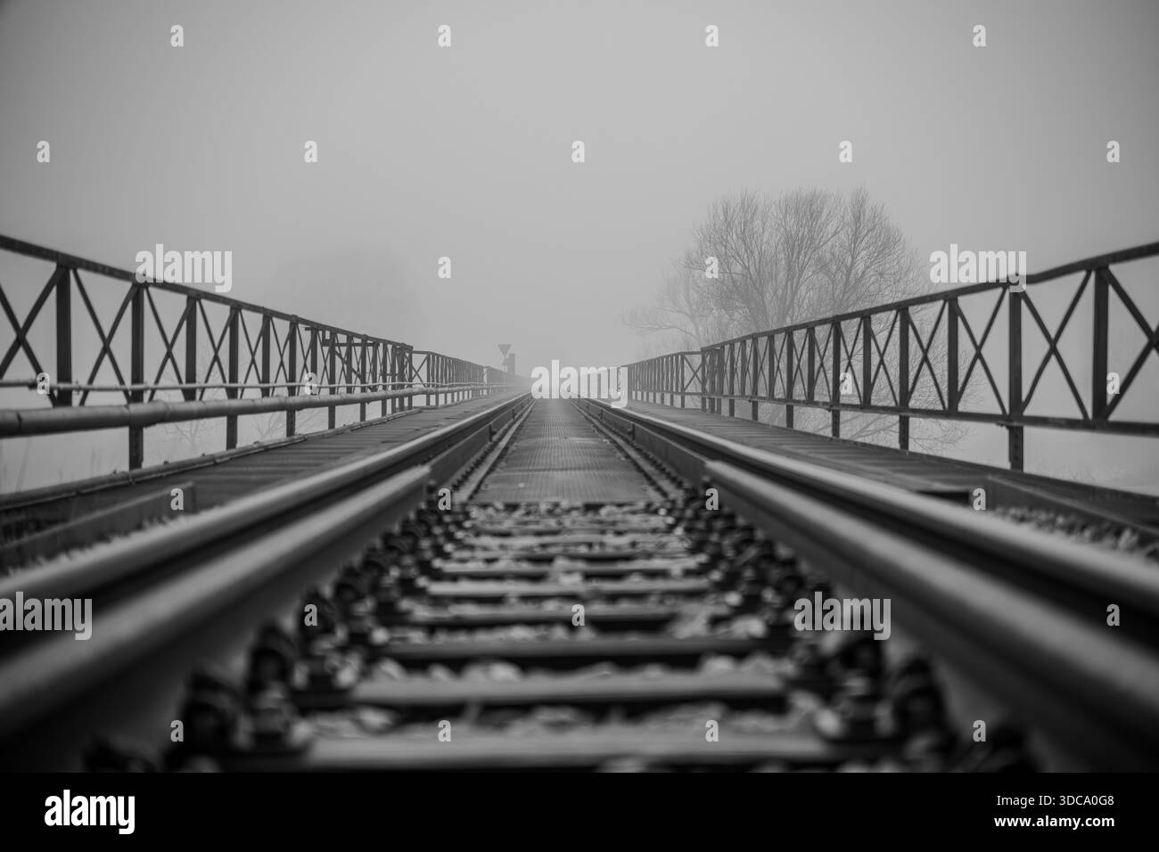 Railroad Bridge In Late Fall With Fog And Little Visibility Stock Photo ...