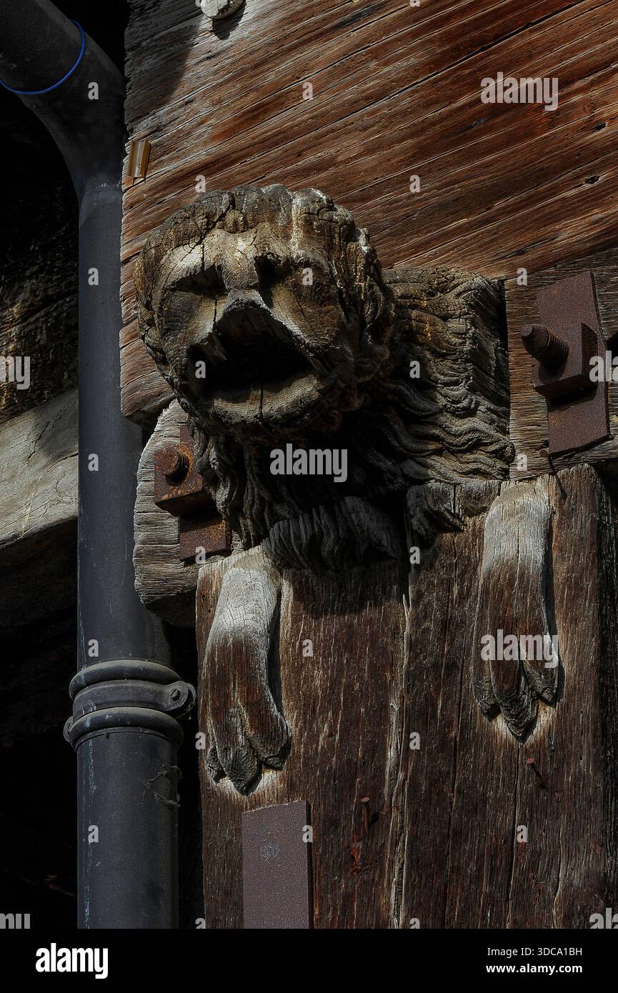 Weathered and eroded sculpted lion with only three toes per paw and ...