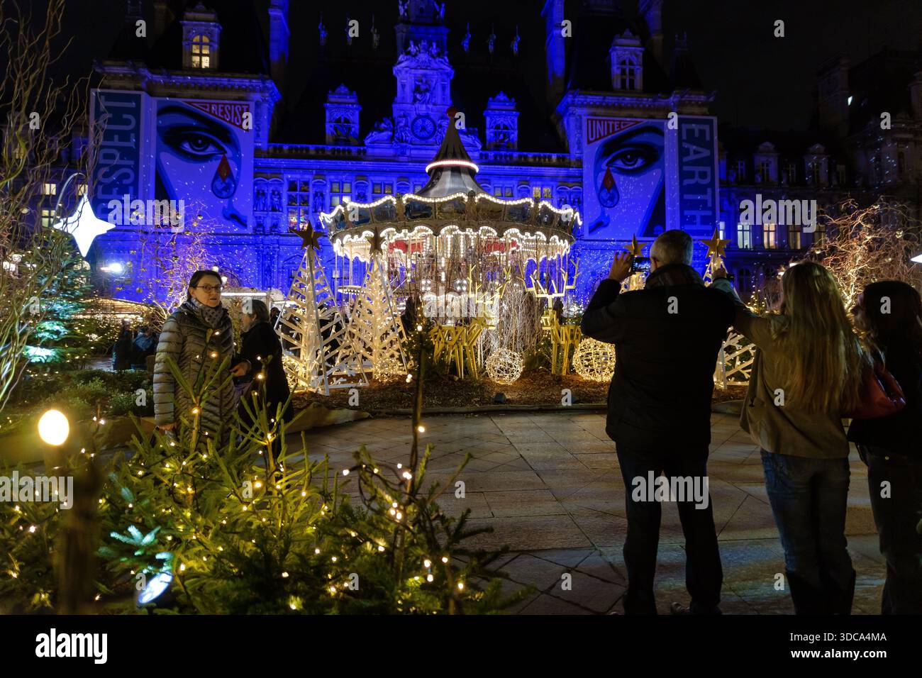 Paris, France - December 10, 2025 : View of people taking photos of the ...