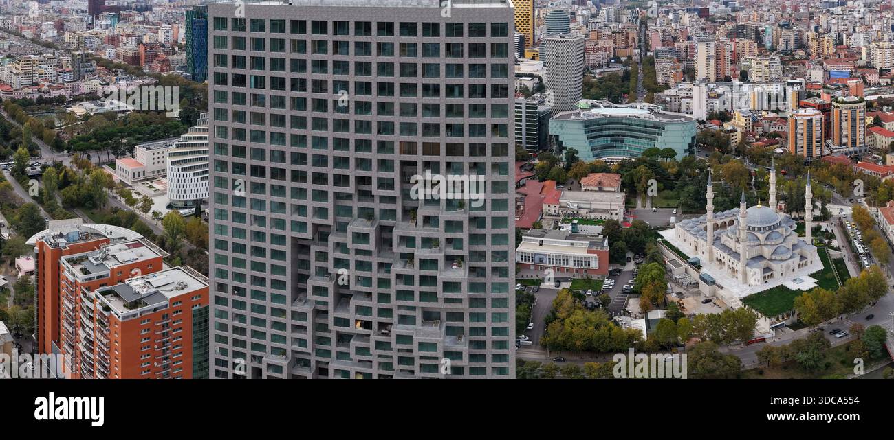 Aerial view of Tirana featuring a modern residential high-rise, the ...