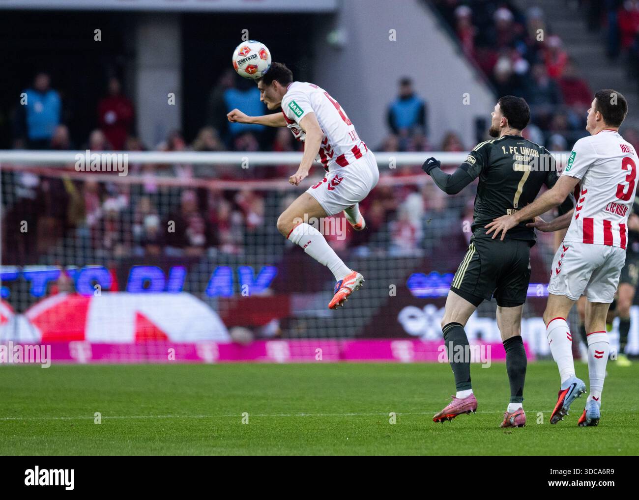 Köln, RheinEnergieStadion, 22.12.2025: Eric Martel of Koeln jumps for a ...