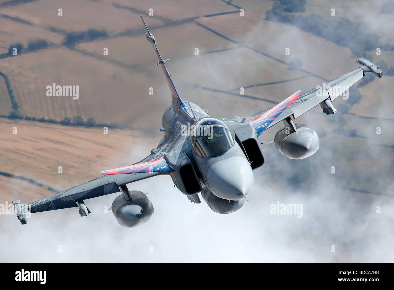 The image shows a Czech Air Force Saab JAS 39C Gripen flying air-to-air ...