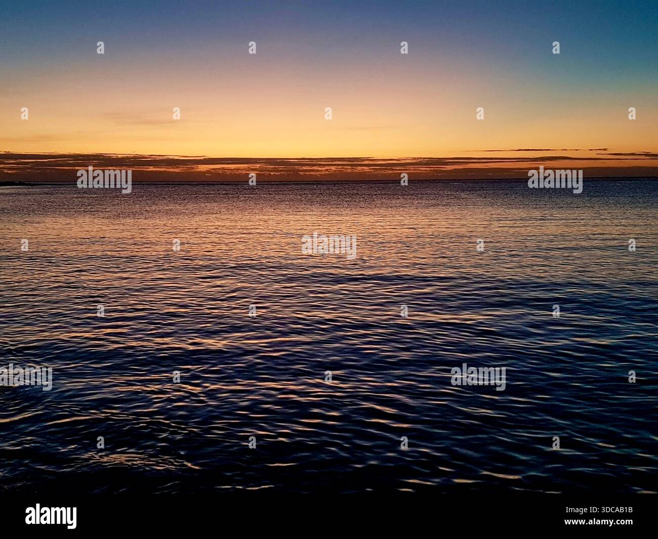 A beautiful and calm morning scene over the Caribbean Sea, where a soft ...