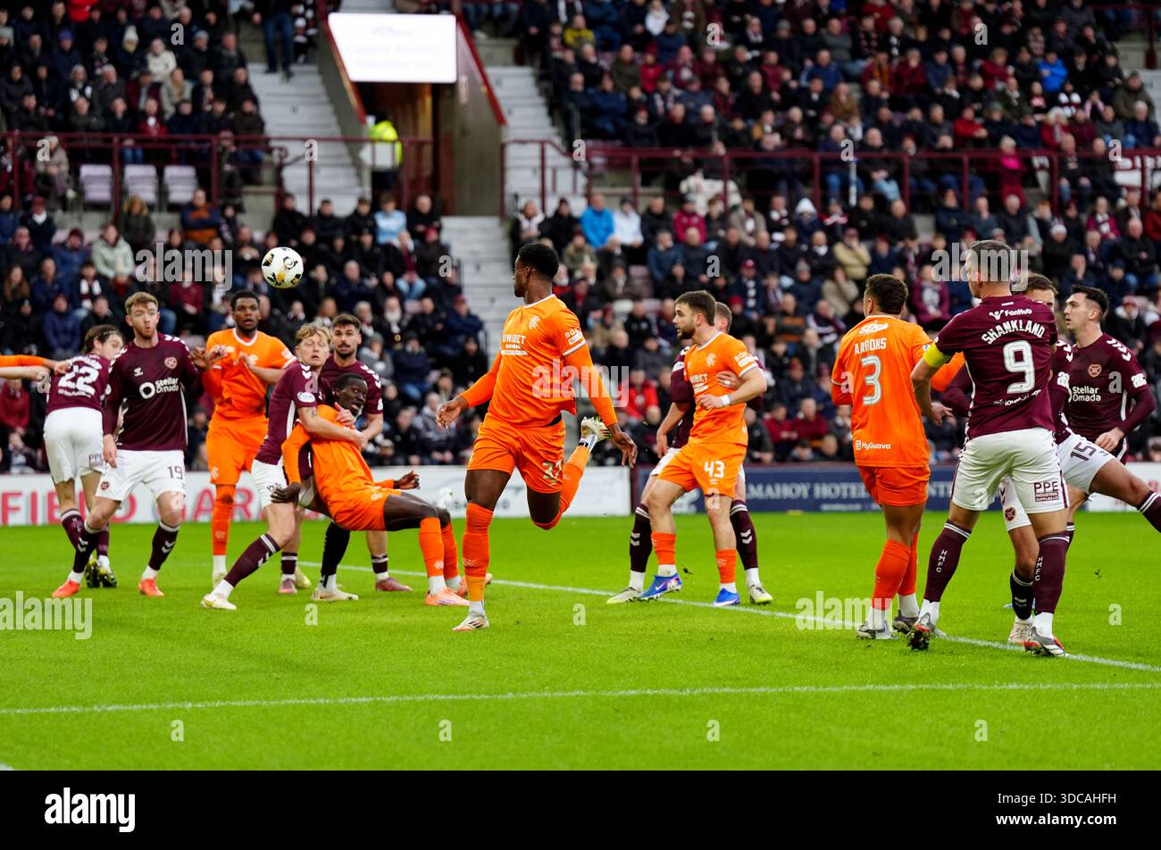 Rangers' Emmanuel Fernandez (centre) header at goal, which was turned ...