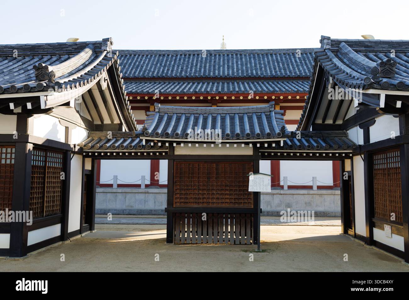 A traditional Japanese temple complex featuring black-and-white wood ...