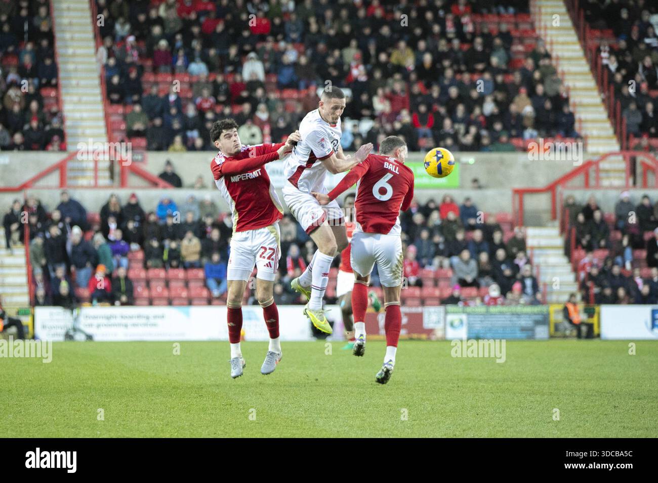 Knight Lebel(L) and James Ball (R) of Swindon and Ryan Loft (C) of ...