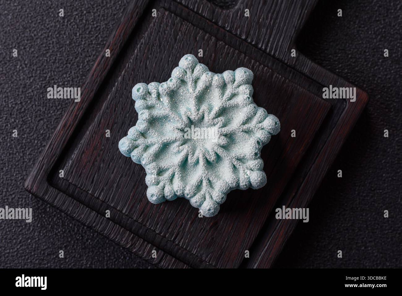Christmas mochi, mooncake, or cheesecake shaped like a snowflake, an ...