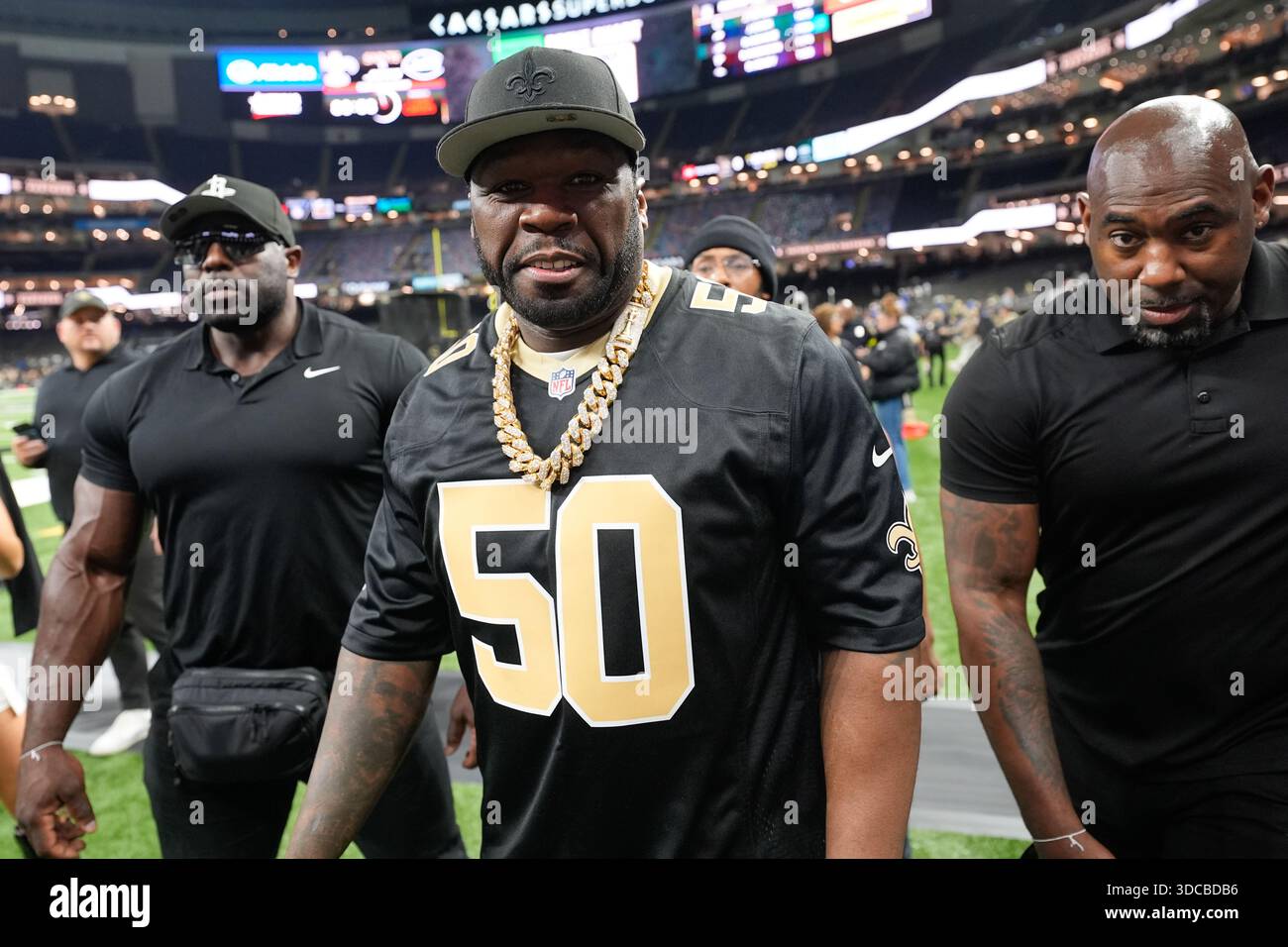 Rapper and actor 50 Cent walks on the sideline before an NFL football ...