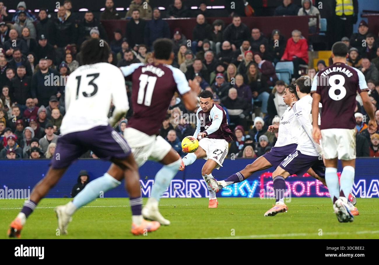 Aston Villa's Morgan Rogers (centre) scores their side's first goal of ...
