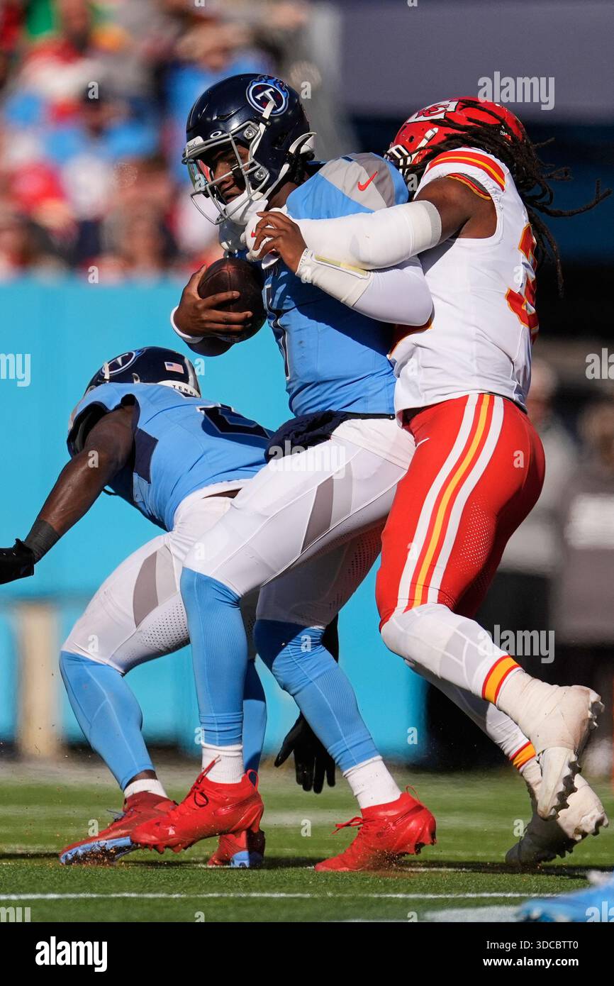 Tennessee Titans quarterback Cam Ward, left, is sacked by Kansas City ...