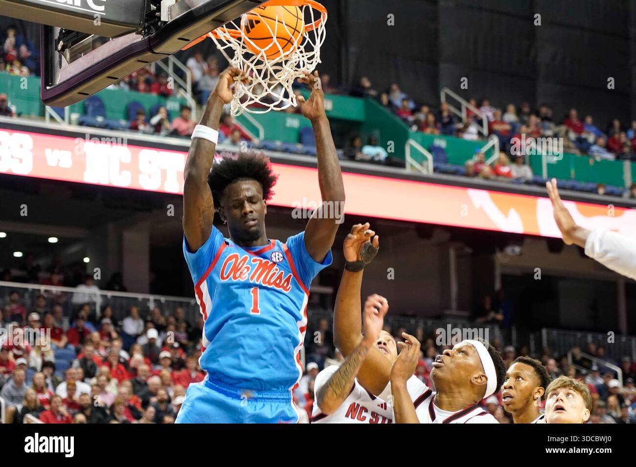 Mississippi forward Corey Chest (1) dunks against North Carolina State ...