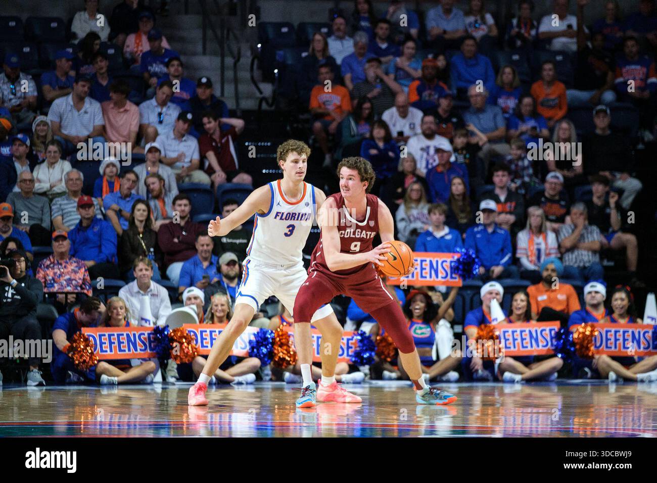 Florida center Micah Handlogten (3) defends Colgate forward Cameron ...