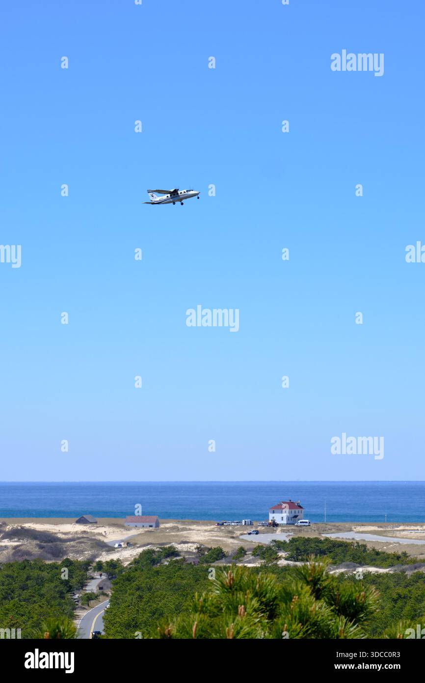 Cape Air flight taking off over Cape Cod's iconic Race Point Beach near ...
