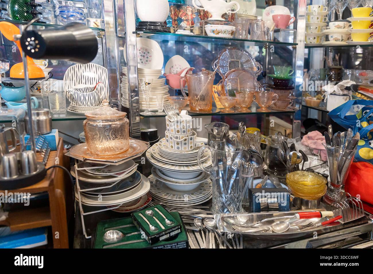 London, UK, December 2, 2025, Cluttered display of vintage kitchenware ...