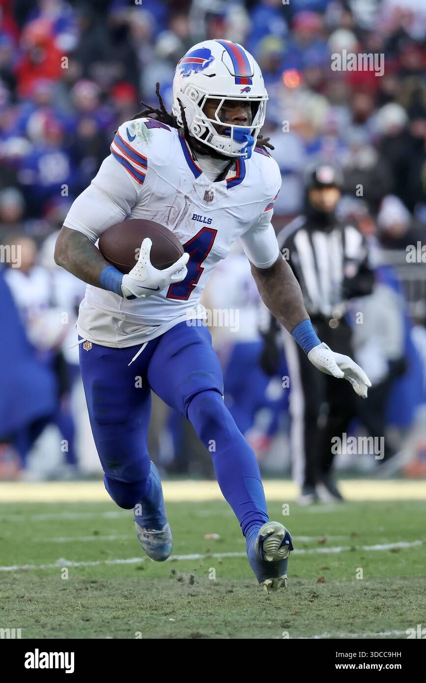 Buffalo Bills running back James Cook (4) runs with the ball during an ...