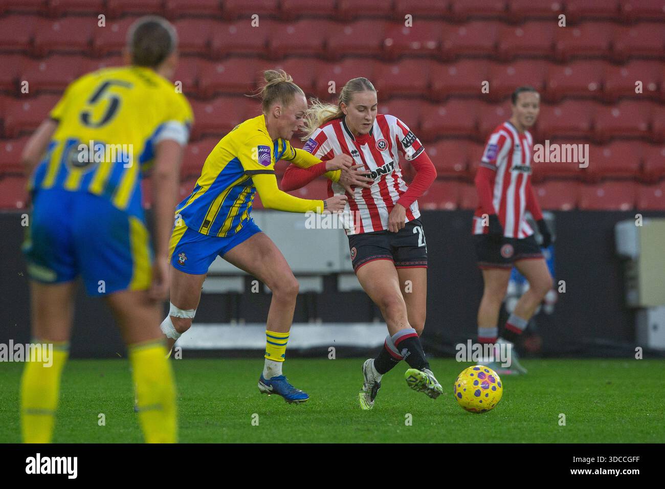 Ruby Tucker (26 Sheffield United) passes the ball under pressure from ...
