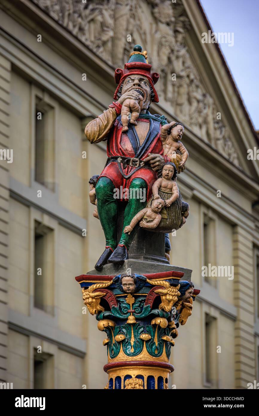 Colorful Kindlifresserbrunnen statue of an ogre devouring children on a ...