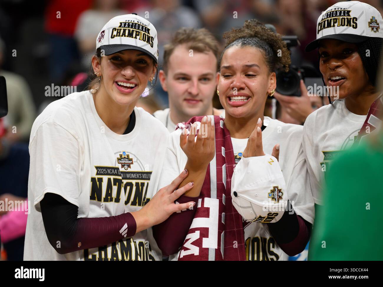 Texas A&M's Kyndal Stowers, center, is hugged by teammate Logan ...