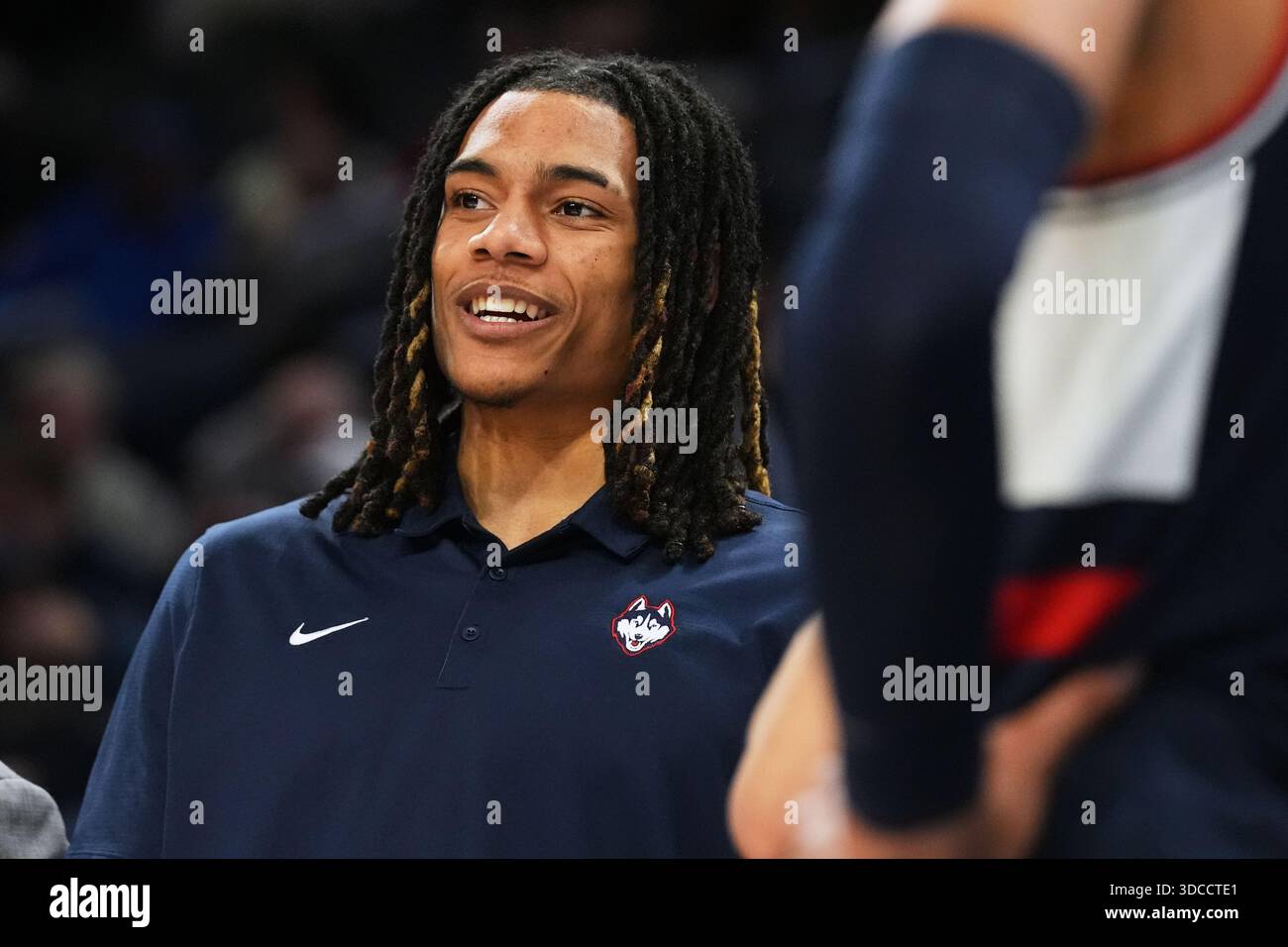 UConn guard Solo Ball watches teammates during the second half of an ...
