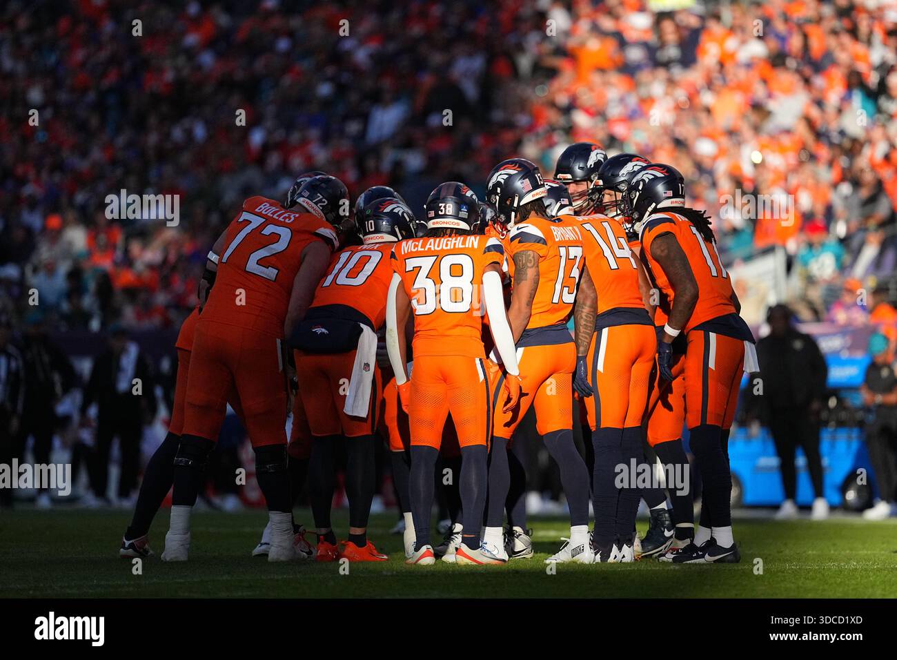 The Denver Broncos offense huddles up against the Jacksonville Jaguars ...