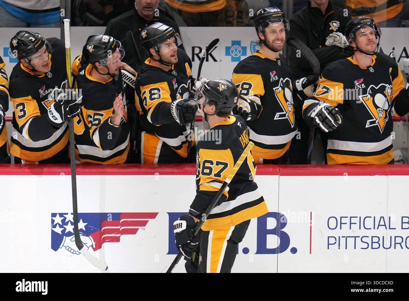 Pittsburgh Penguins' Rickard Rakell (67) returns to the bench after ...