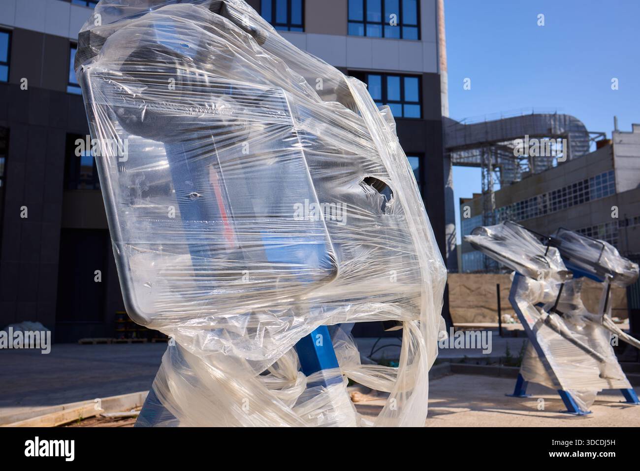 New construction equipment has been secured and carefully wrapped for ...