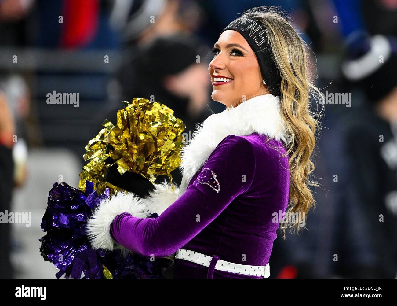 Baltimore Ravens cheerleaders are dressed in purple Santa suits during ...