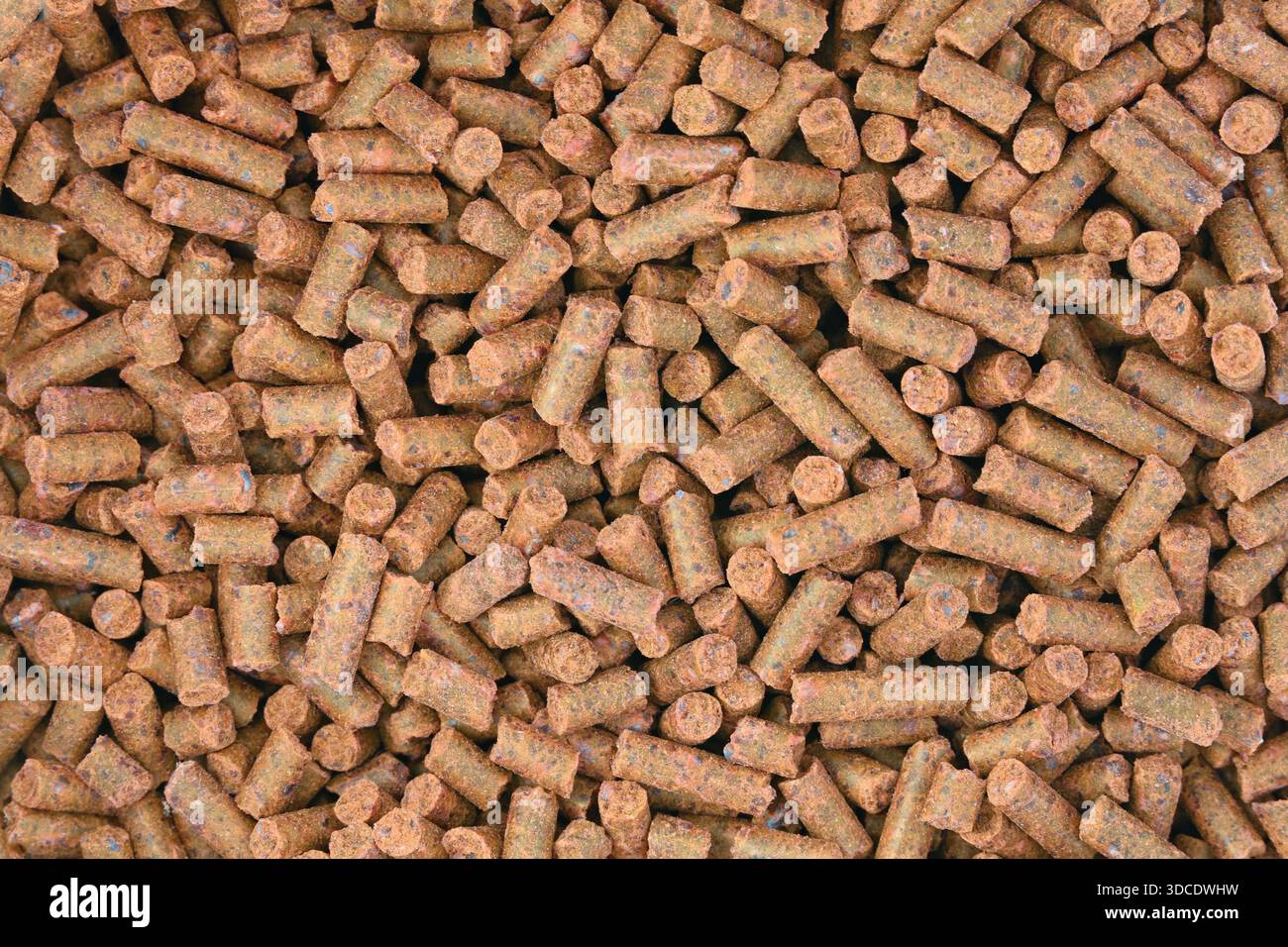 Brown pellets as organic background background Stock Photo - Alamy
