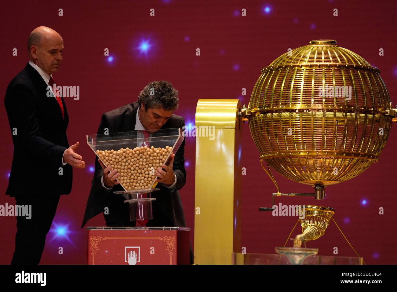Workers prepare the numbered lottery balls ahead the annual Christmas ...