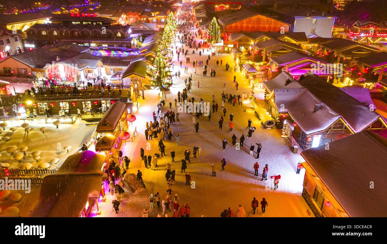 Aerial photo shows the night view of the China Snow Town scenic area in ...