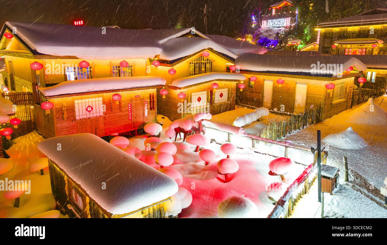 Aerial photo shows the night view of the China Snow Town scenic area in ...