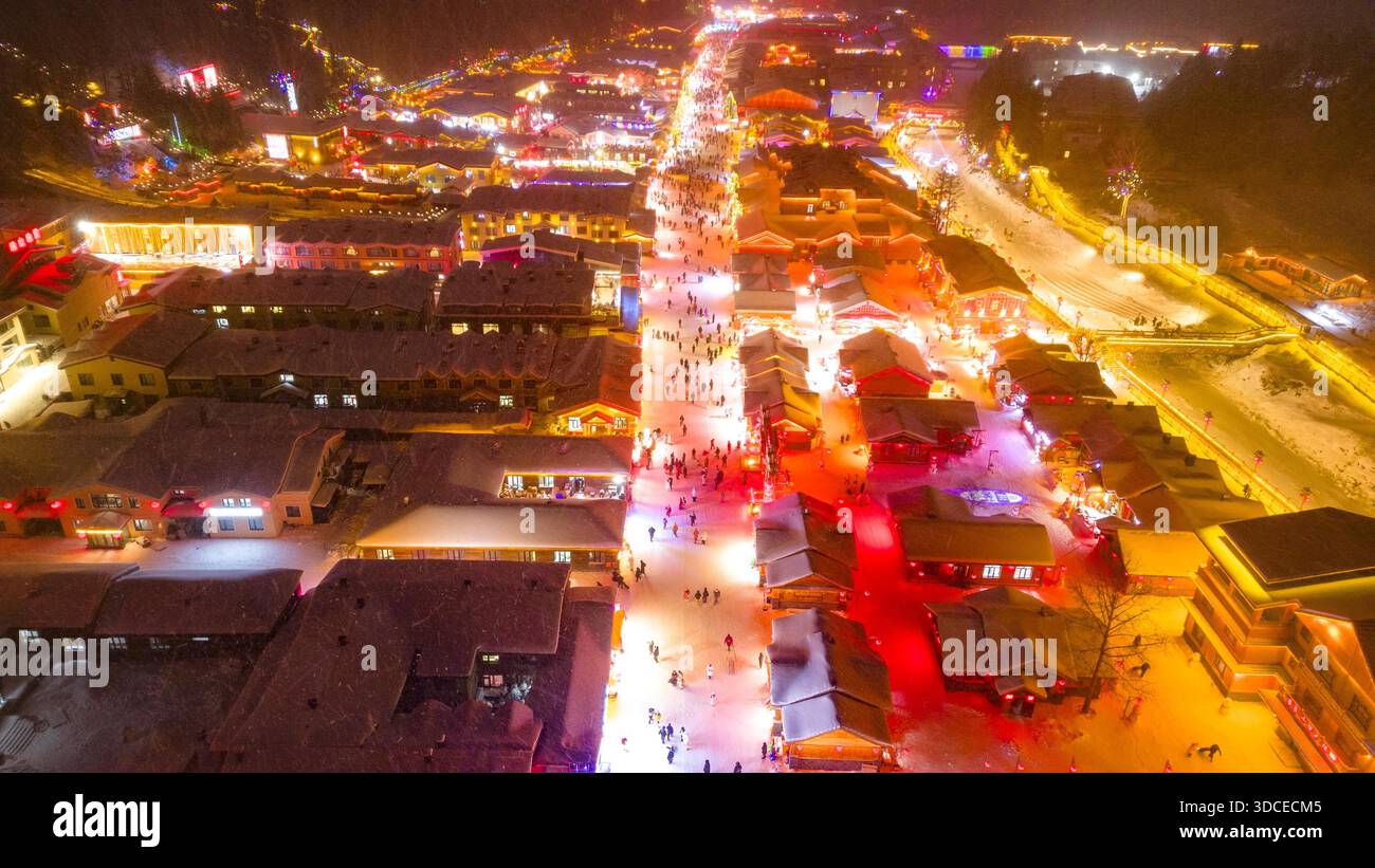 Aerial photo shows the night view of the China Snow Town scenic area in ...