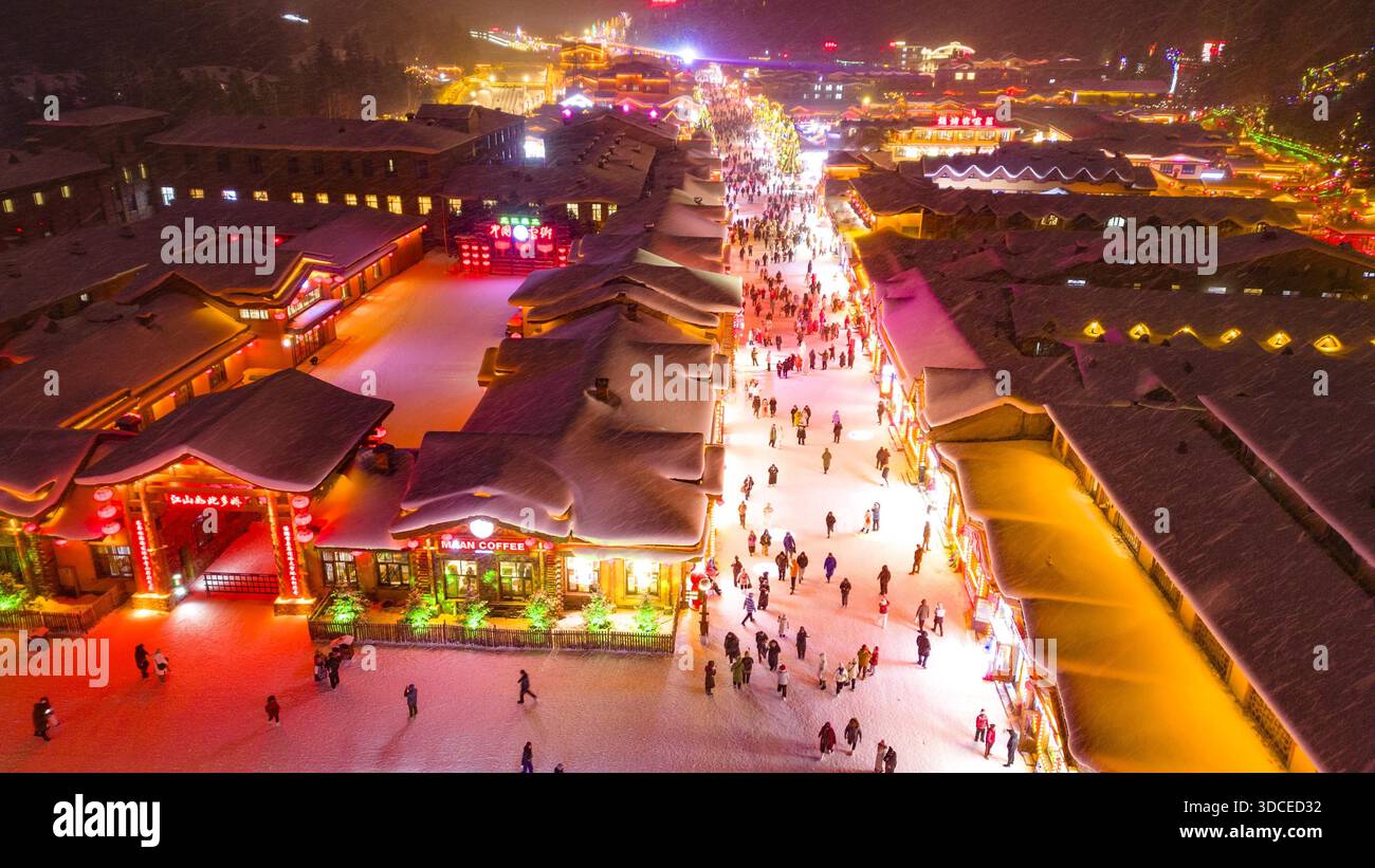 Aerial photo shows the night view of the China Snow Town scenic area in ...