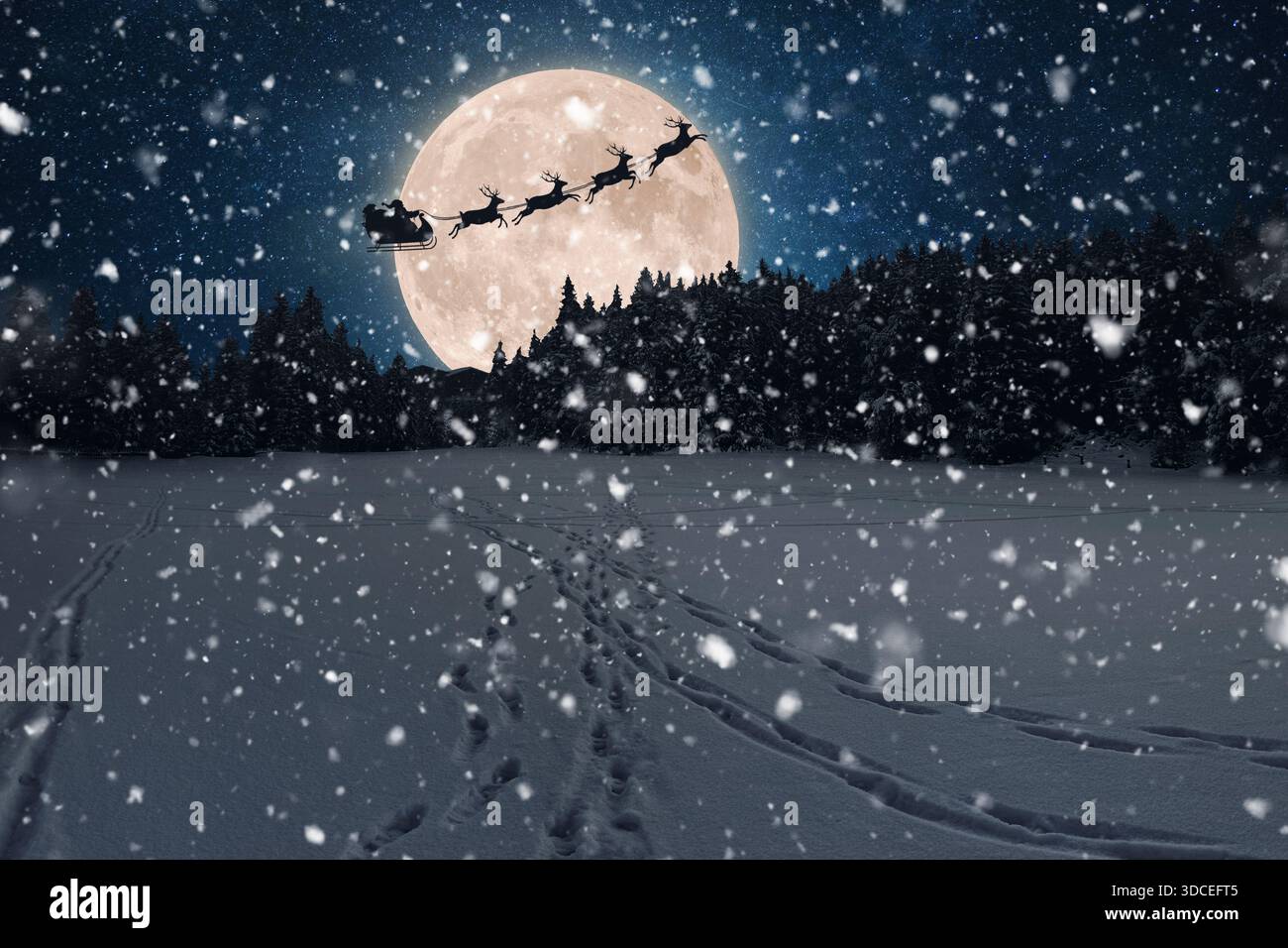 Santa's sleigh and reindeer fly silhouetted across a giant full moon in ...