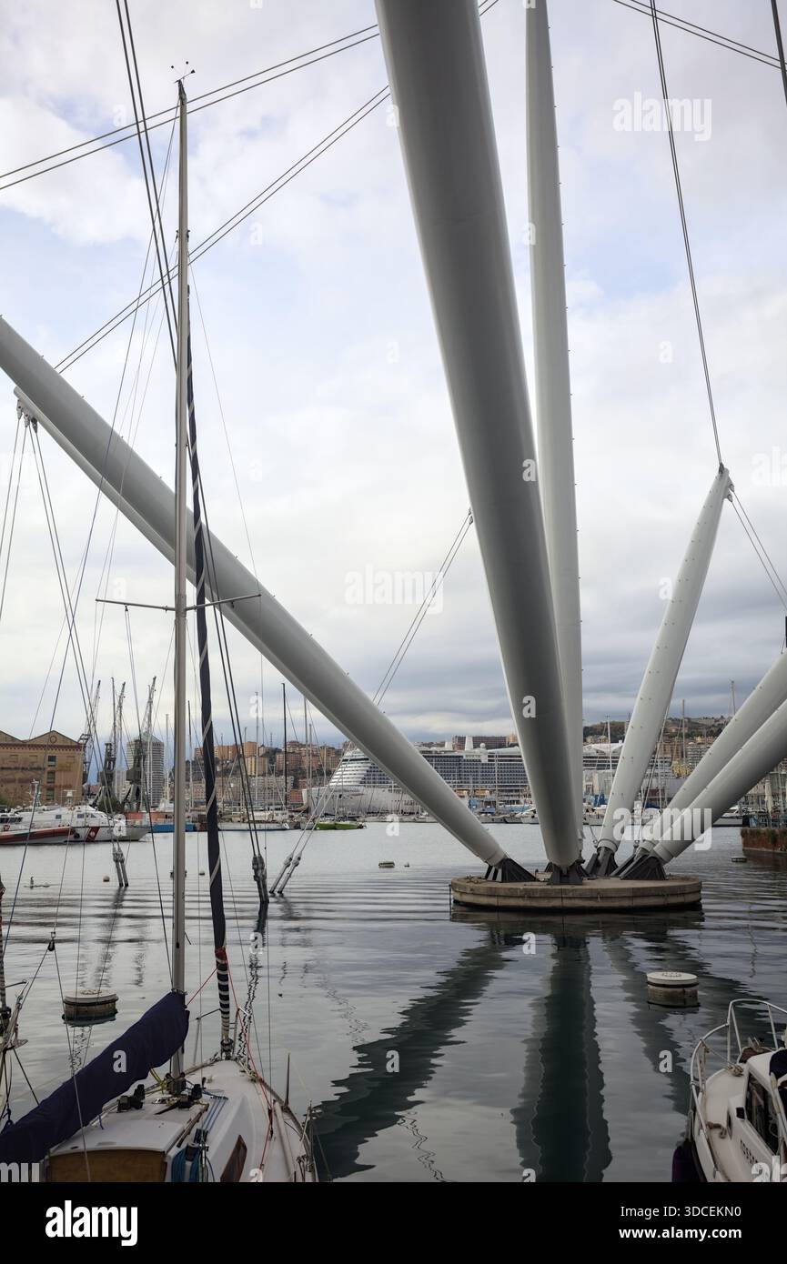 Harbour with moored sailing ship next to a white metallic structure and ...